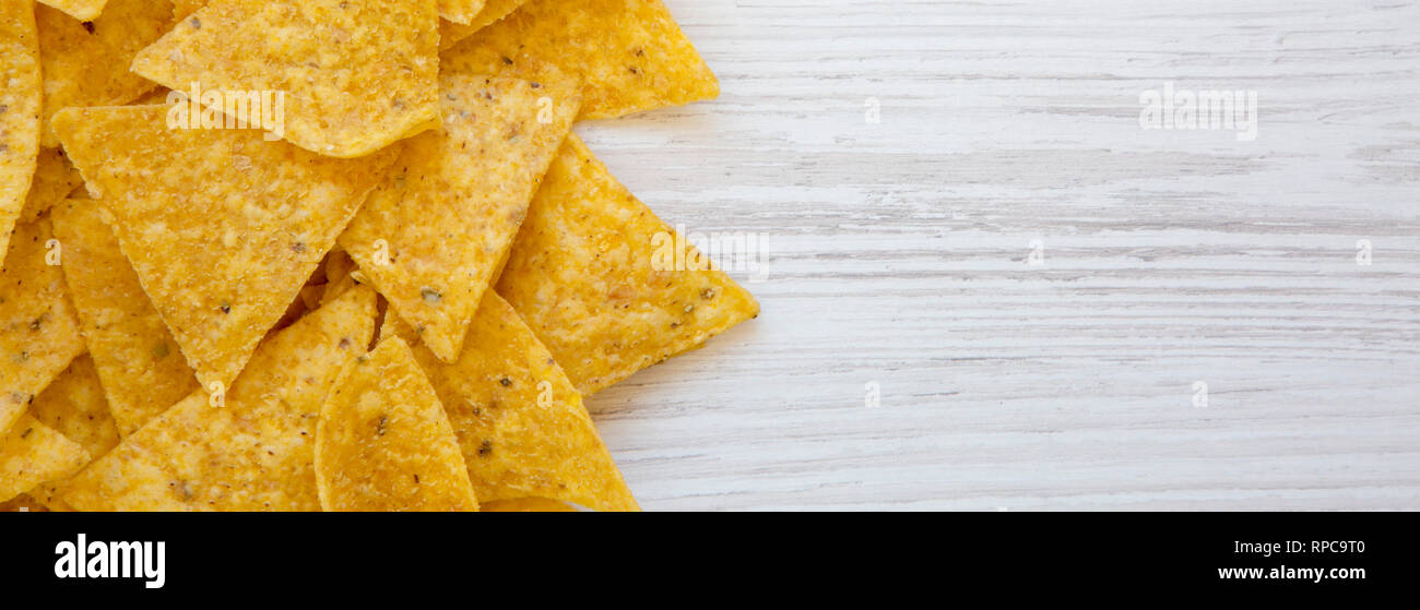 Top view, tortilla chips on white wooden background. Mexican food. Flat ...