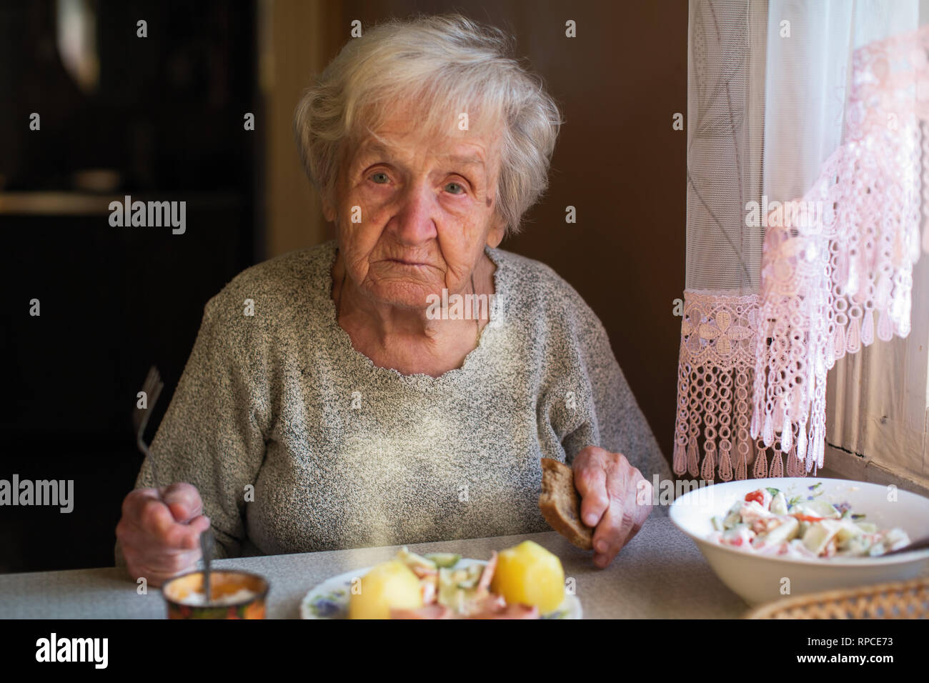 Elderly mature woman dining table hi-res stock photography and images ...