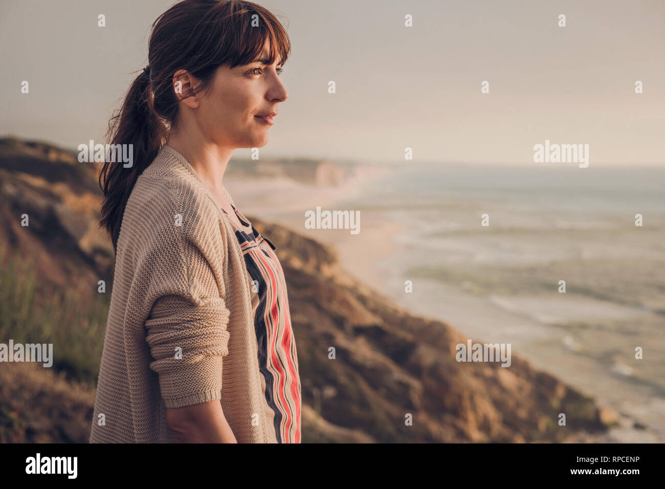 Beautiful woman enjoying the simple things of life Stock Photo - Alamy