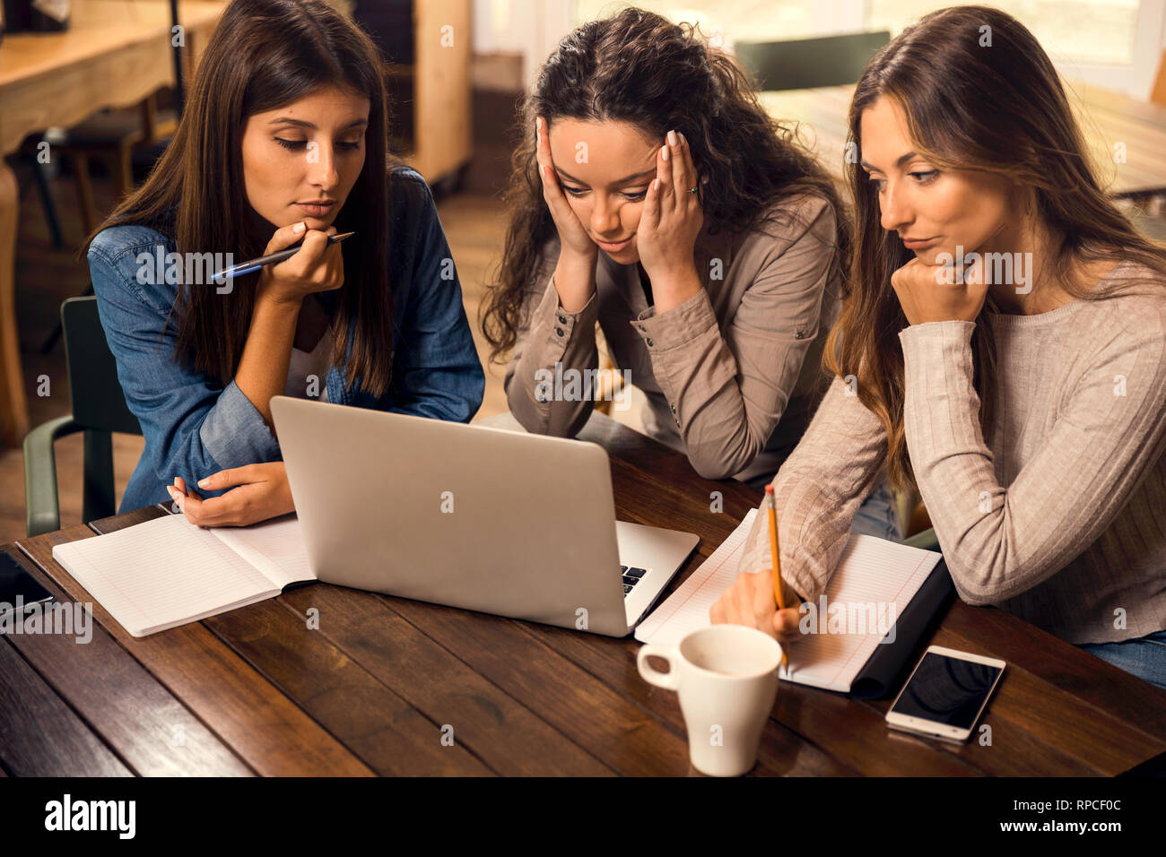 Group of friends studying together and worried with final exams Stock ...