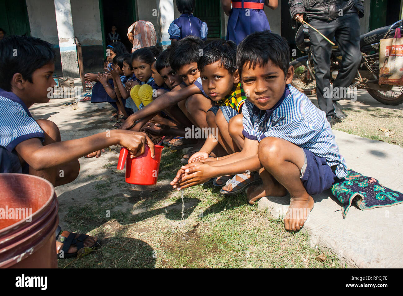 Indian child hand washing hi-res stock photography and images - Alamy