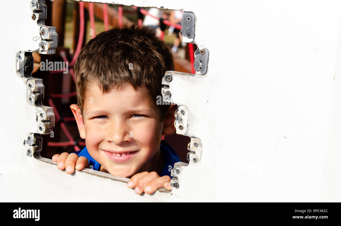Child peeking window hi-res stock photography and images - Alamy