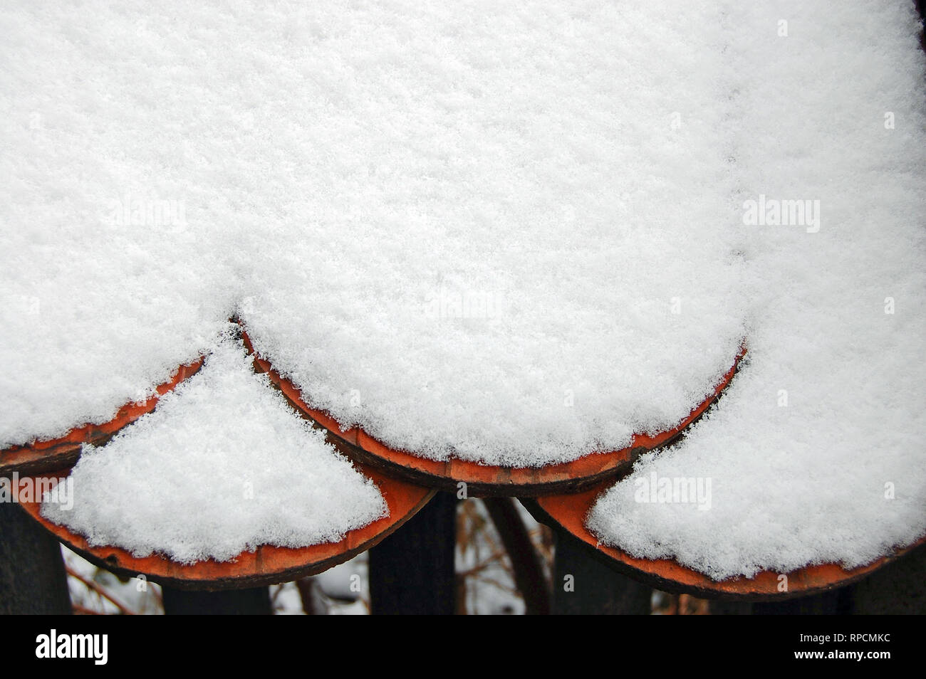 Snow covered tiles Stock Photo - Alamy