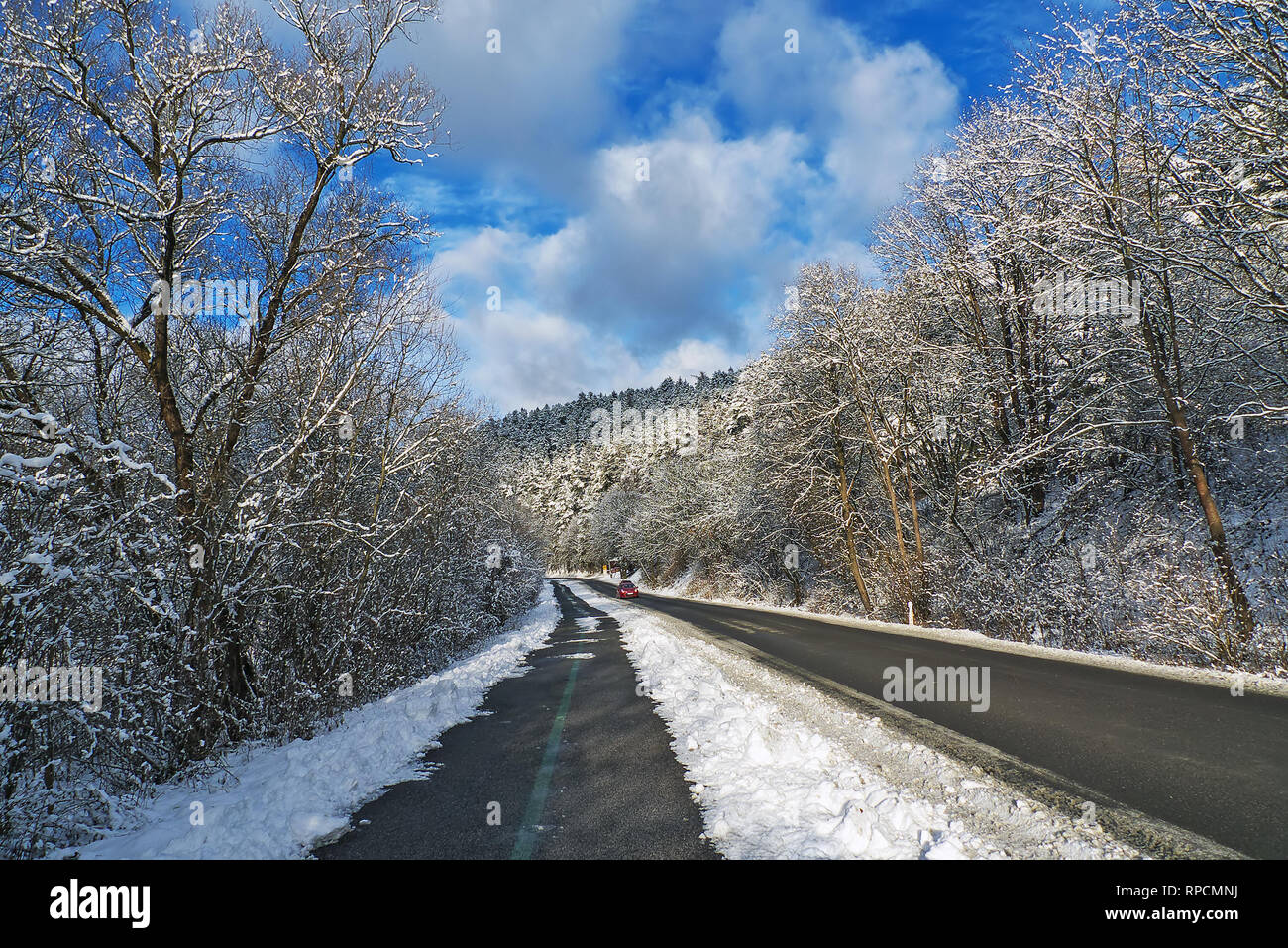 Road with walkway in winter Stock Photo - Alamy