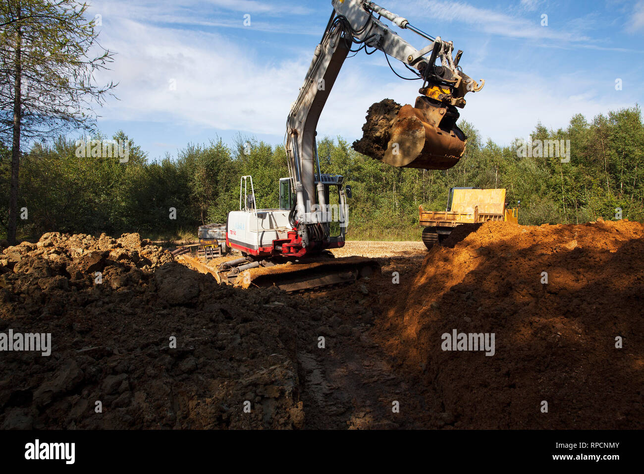 Collecting clay for stream restoration work hi-res stock photography ...