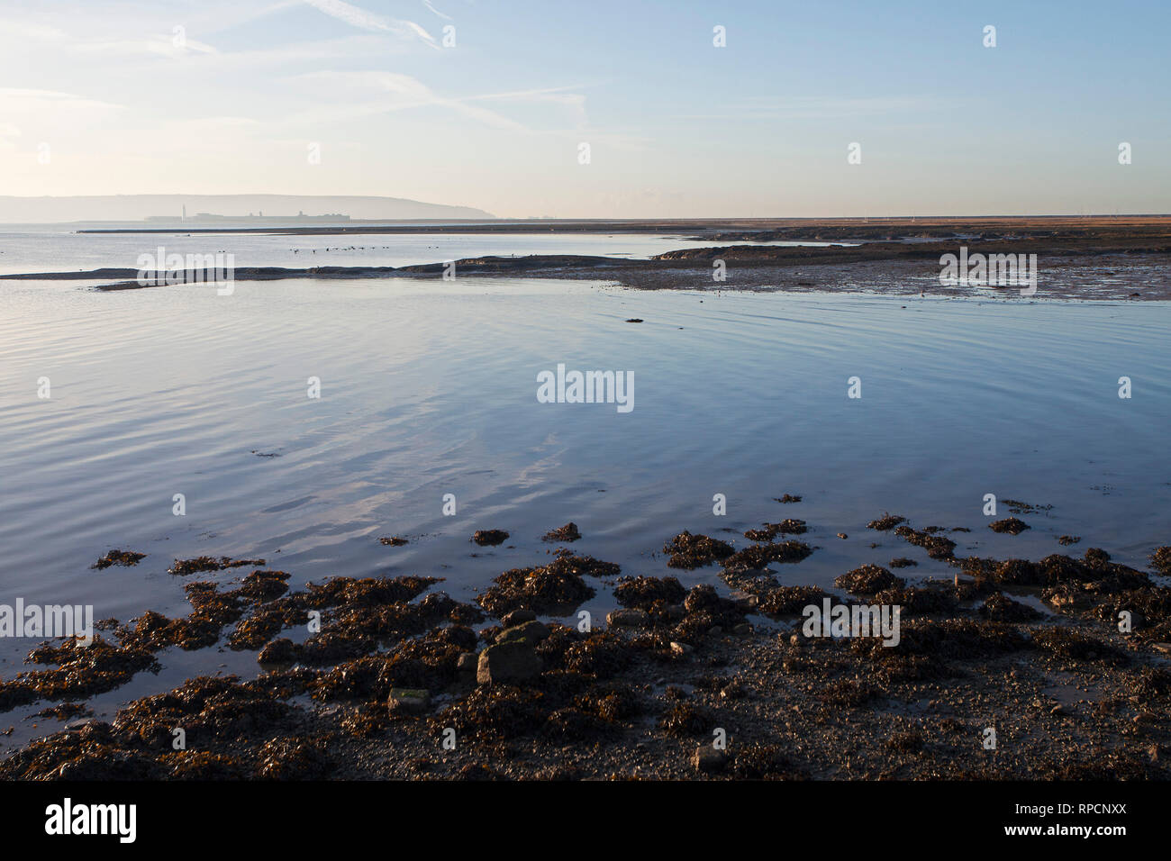 Incoming tide at Keyhaven with the Isle of Wight the Needles and Hurst ...