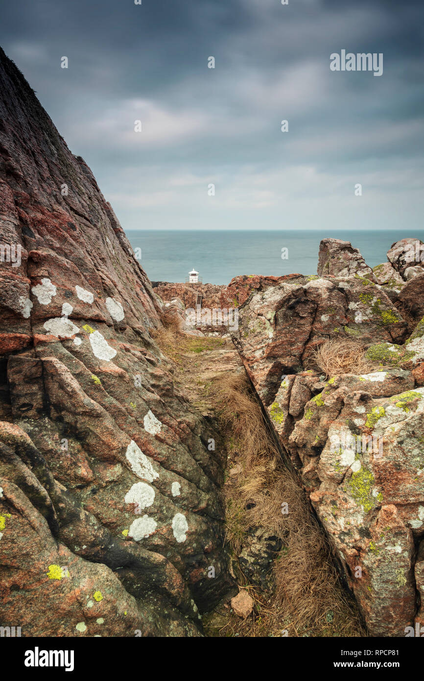 Jagged cliffs in coastal national park. Kullaberg, Sweden Stock Photo ...