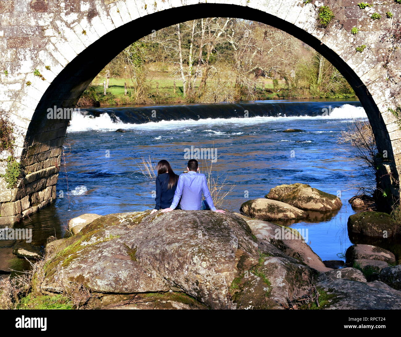 Girl sitting by natural arch hi-res stock photography and images - Alamy