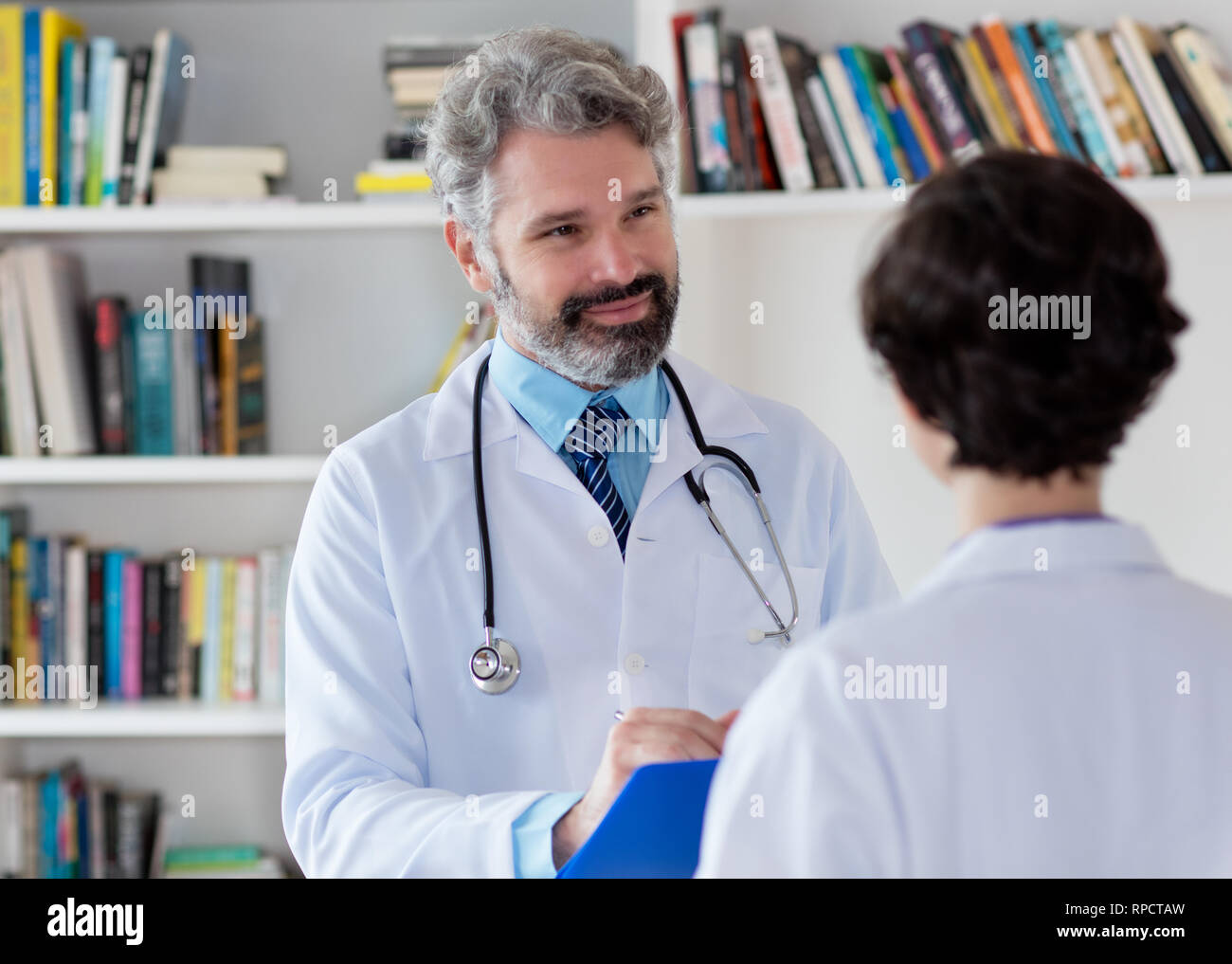 German doctor in disucssion with medical student at hospital Stock ...
