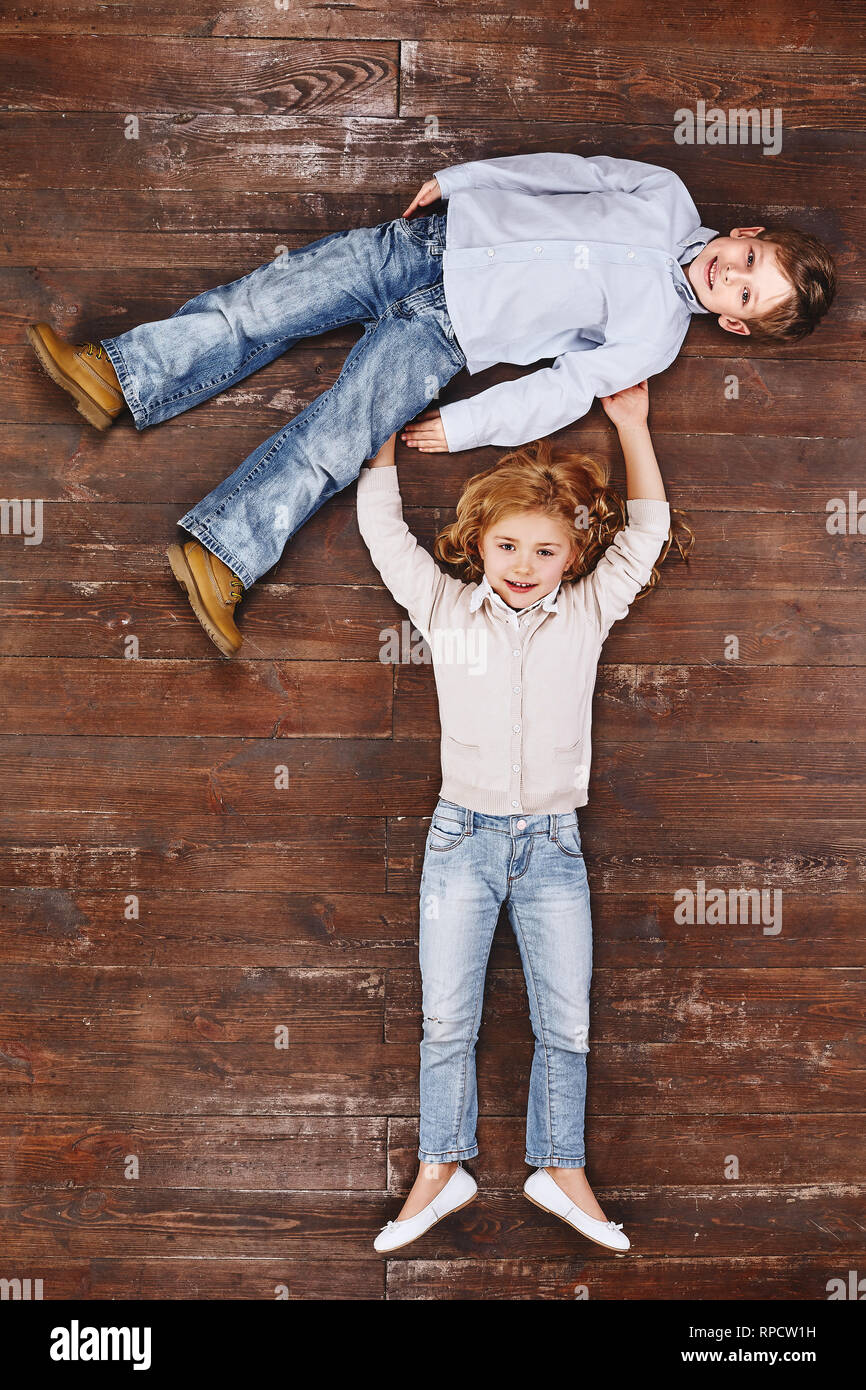 Happy children. Top view creative photo of little boy and girl on ...