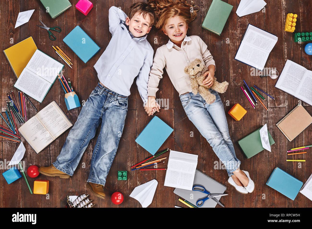 Happy children. Top view creative photo of little boy and girl on ...