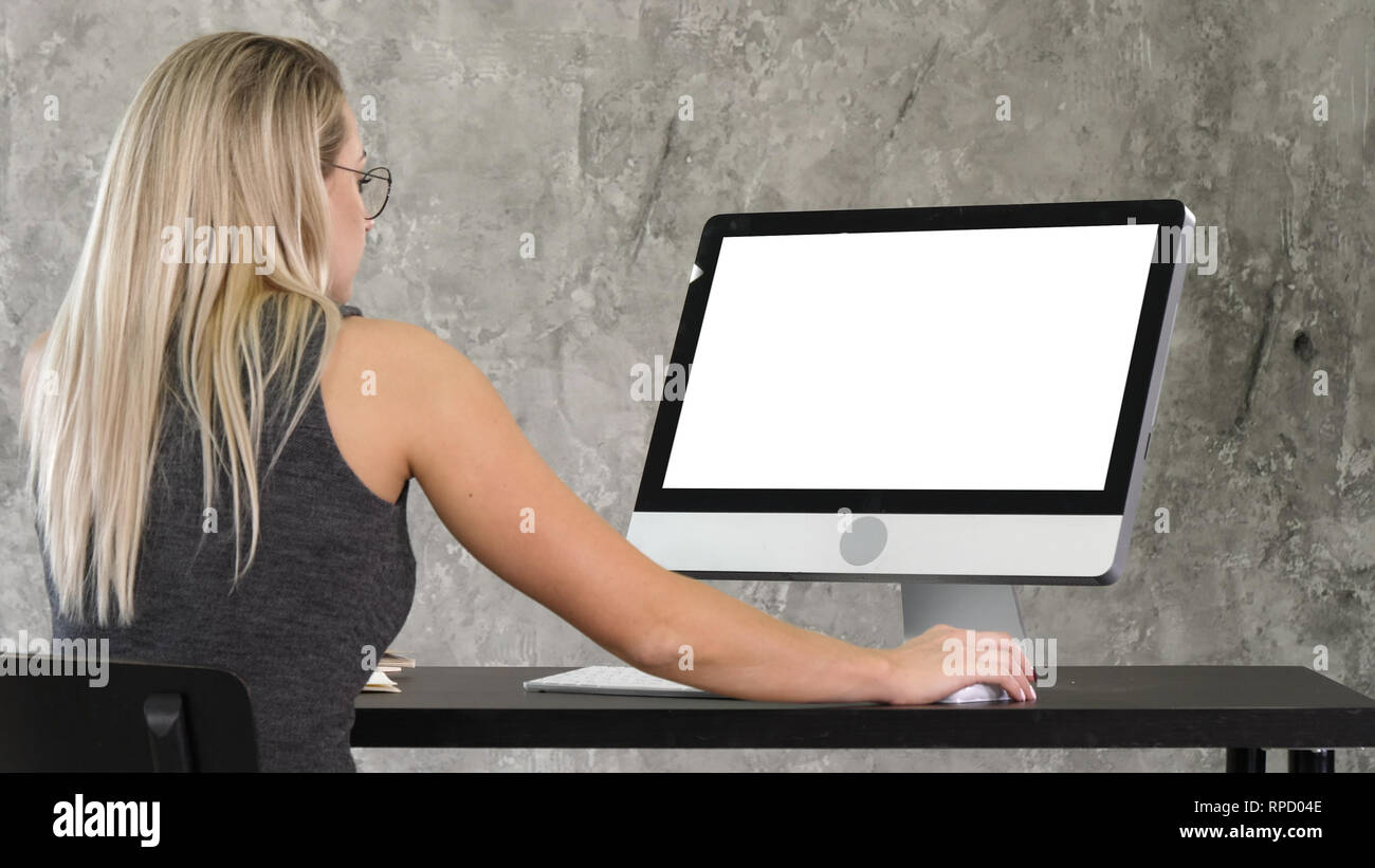 View to the screen of computer. Young friendly operator woman talking ...