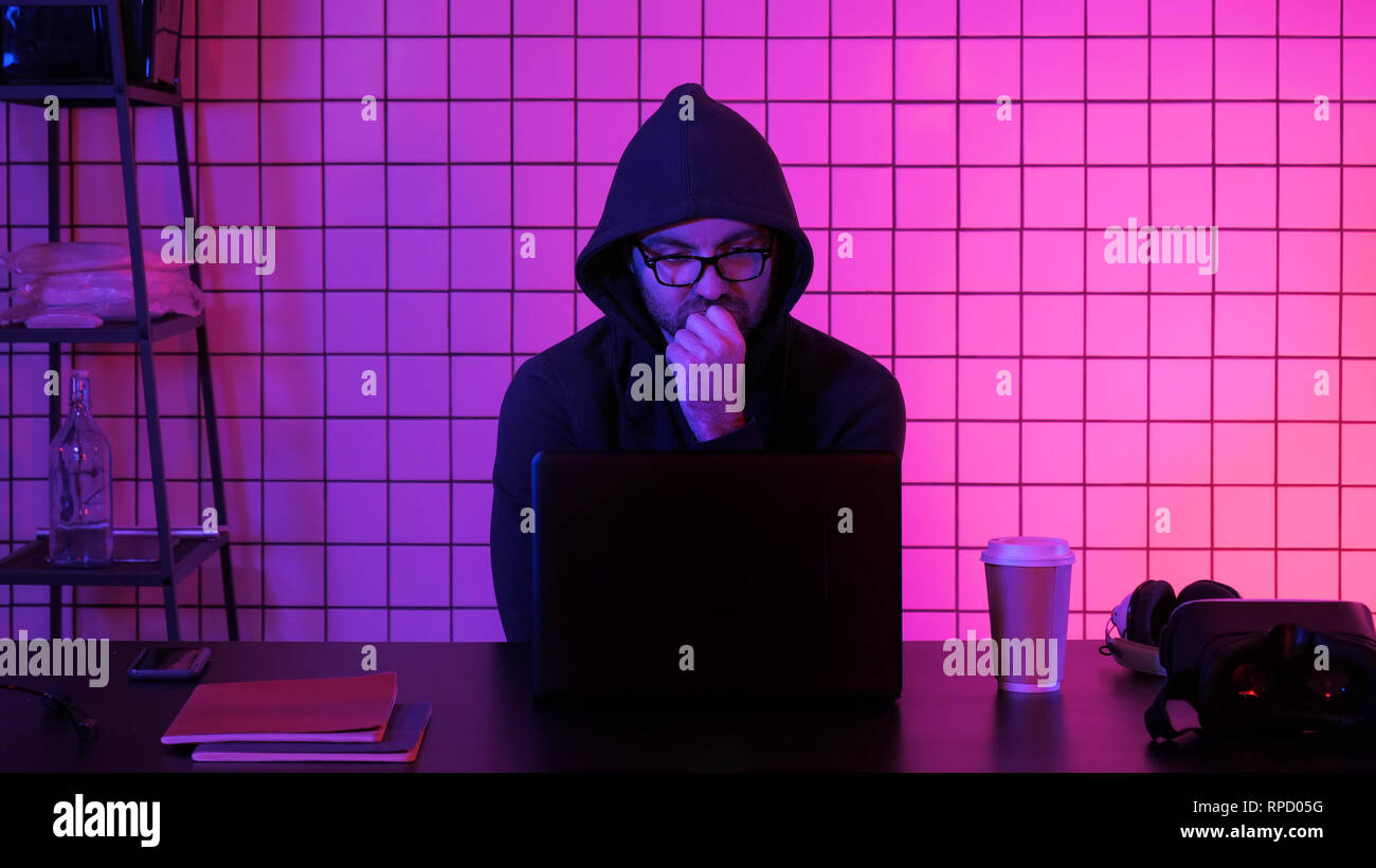Gamer or streamer watching stream on a laptop. Professional shot in 4K ...