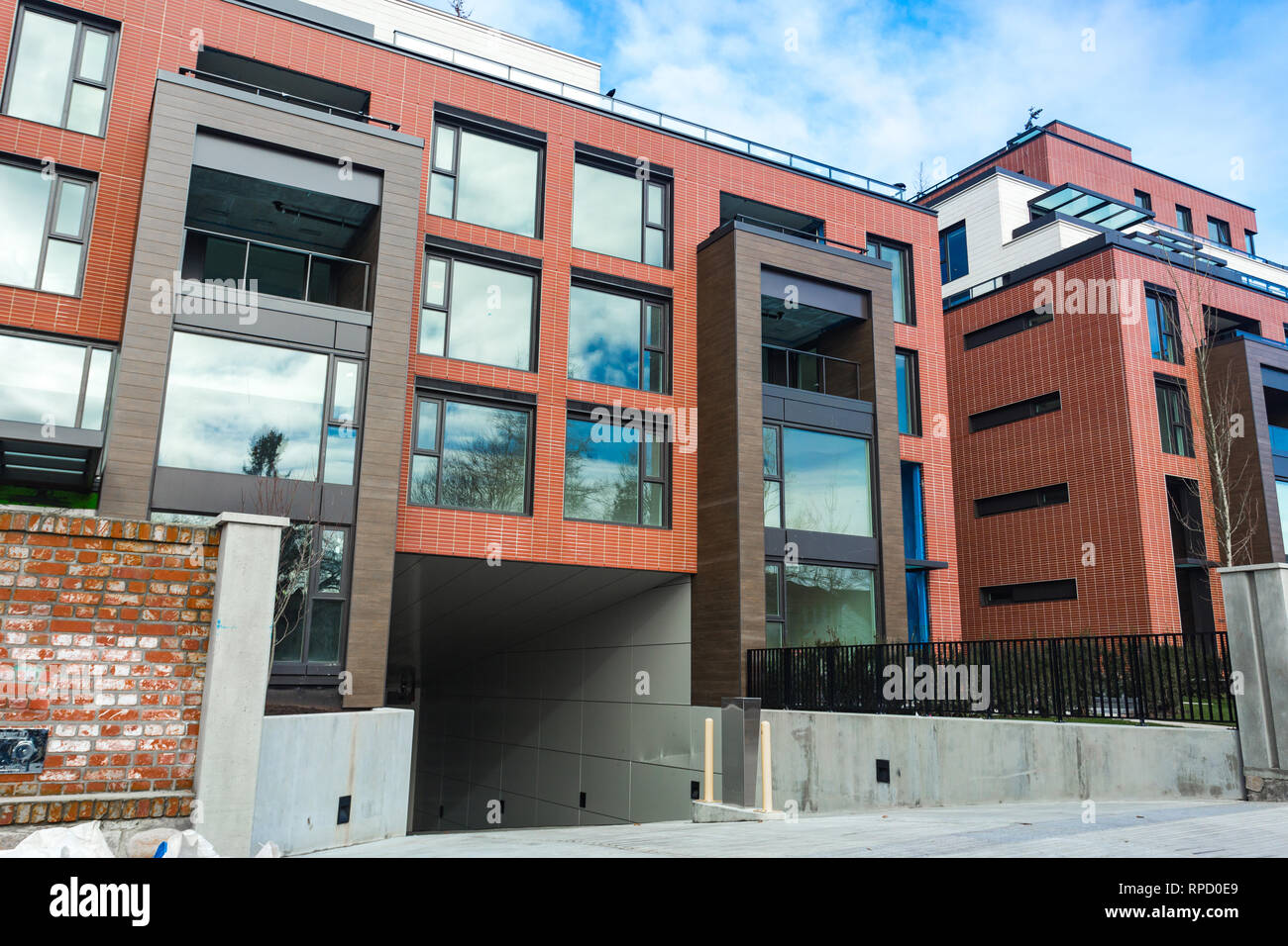 Low angle view on modern residential brick apartment building exterior ...