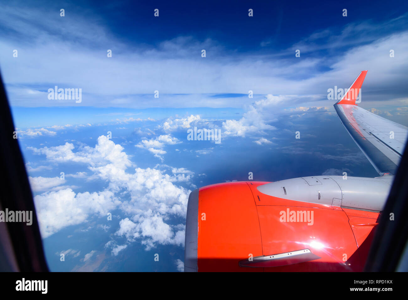 Arial view from internal cabin of aeroplane.Clouds in the sky and ...