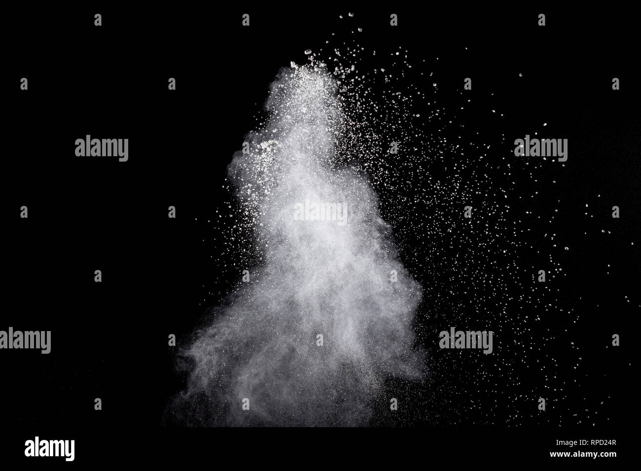 White powder explosion isolated on black background. White dust ...