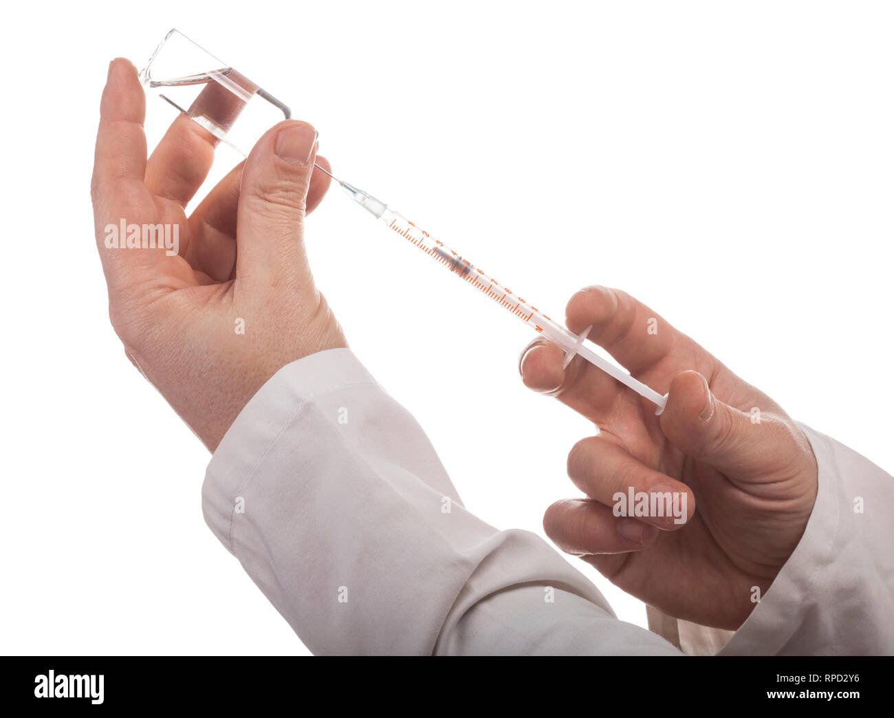 A syringe and a bottle with an injection solution on white background ...