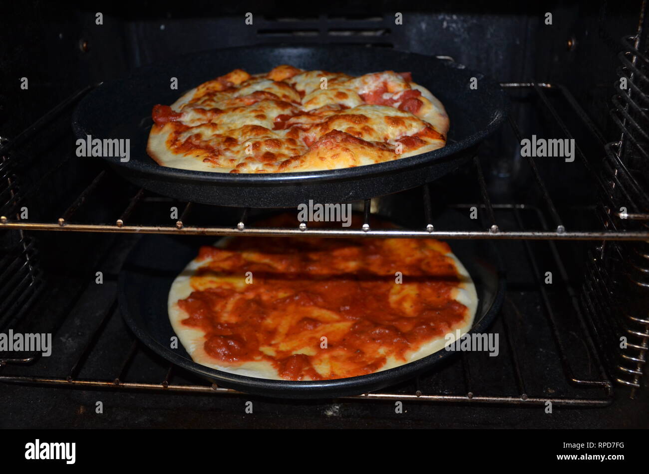 fresh Pizza cooking in the oven, fast food Stock Photo - Alamy
