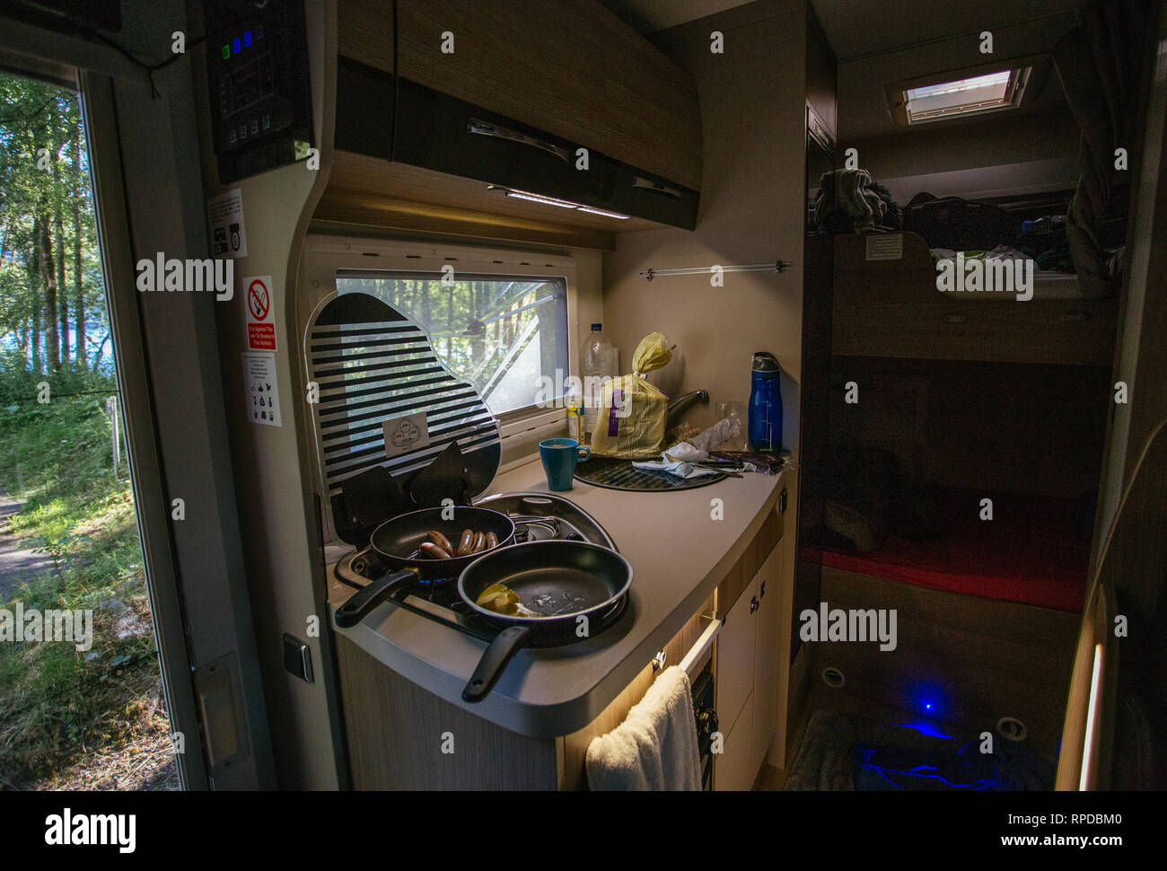 Making breakfast in a campervan Stock Photo - Alamy