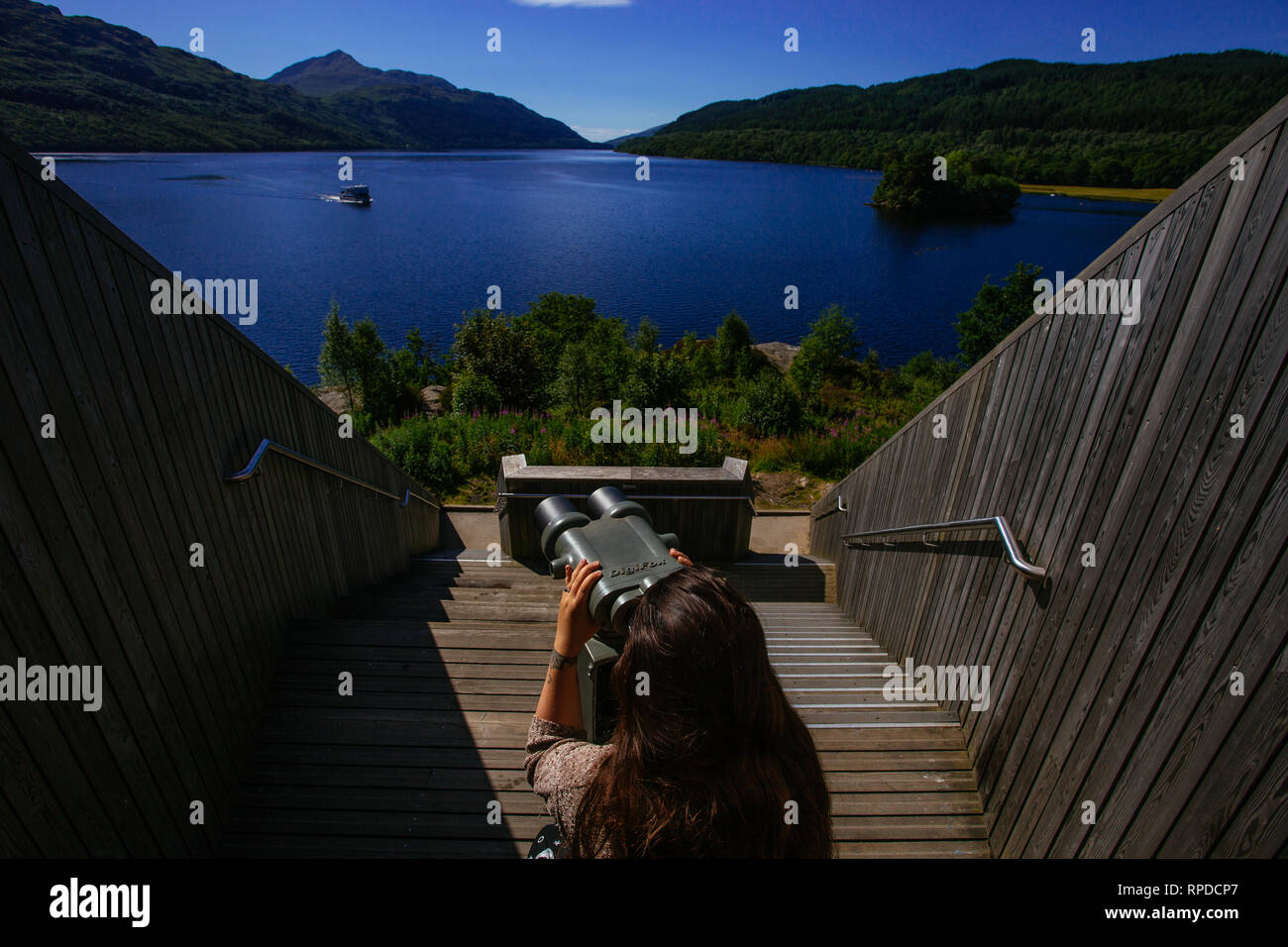 People using telescope Stock Photo - Alamy