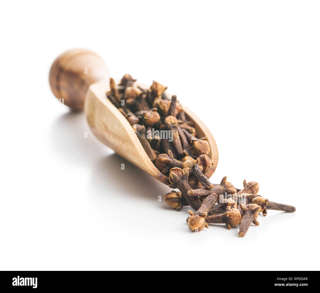 Carnation, dried clove spice in wooden scoop isolated on white ...