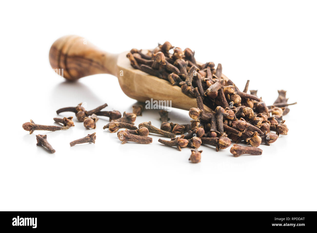 Carnation, dried clove spice in wooden scoop isolated on white ...