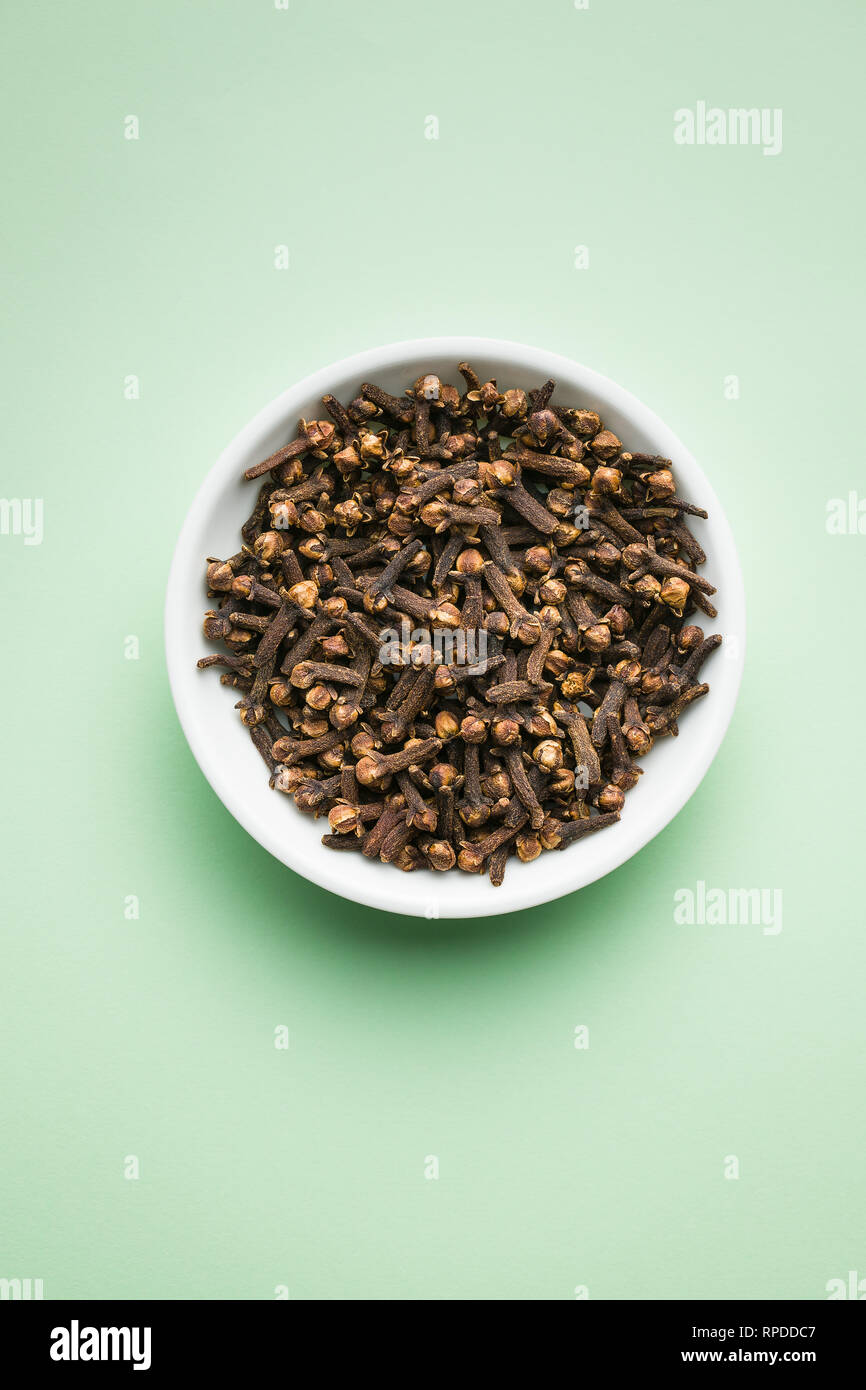 Carnation, dried clove spice on colorful background Stock Photo - Alamy