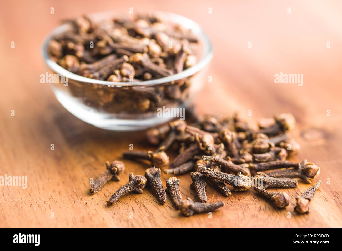 Carnation, dried clove spice on wooden table Stock Photo - Alamy