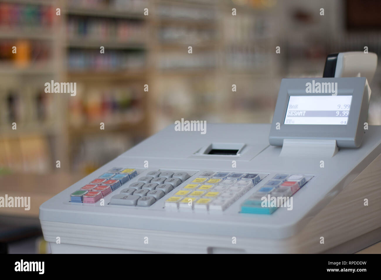 Cash register in a shop: Customer is paying purchase Stock Photo - Alamy