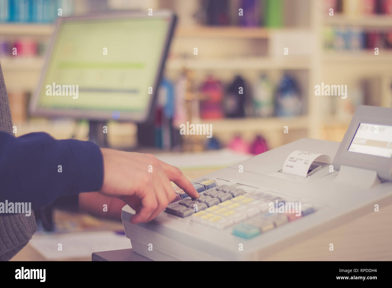 Cash register in a shop: Customer is paying purchase Stock Photo - Alamy