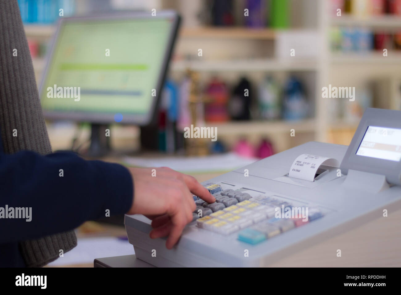 Cash register in a shop: Customer is paying purchase Stock Photo - Alamy