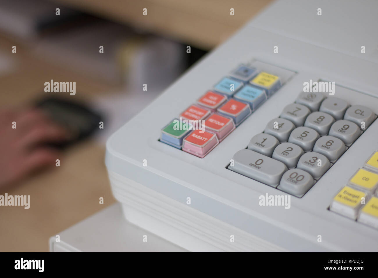 Cash register in a shop: Customer is paying purchase Stock Photo - Alamy