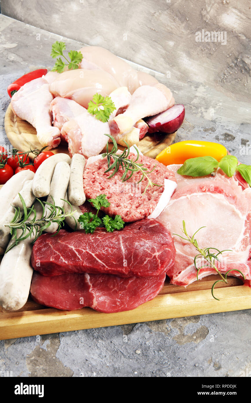 raw meat. Different types of raw pork meat, chicken and beef with ...