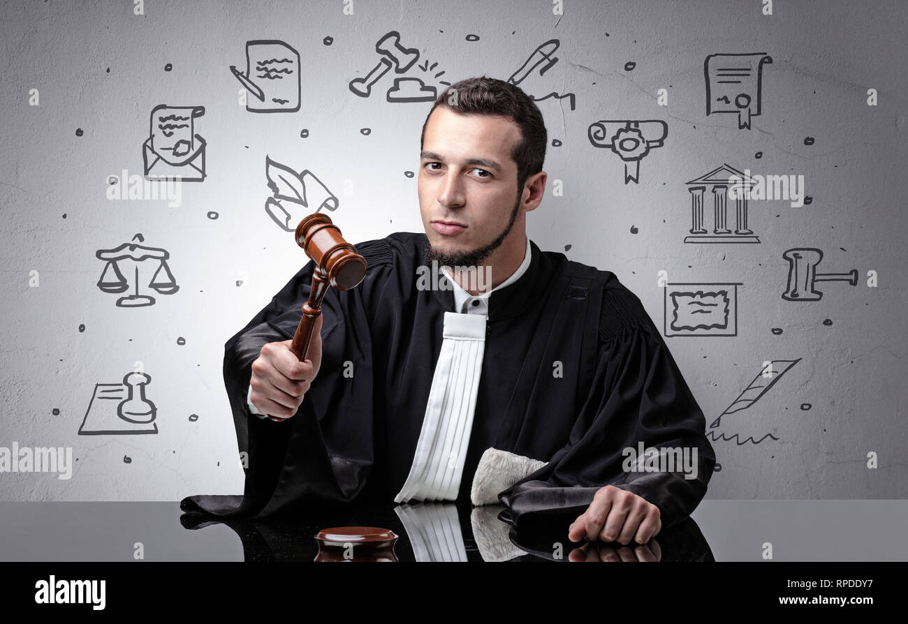 Handsome judge with court symbols around Stock Photo - Alamy