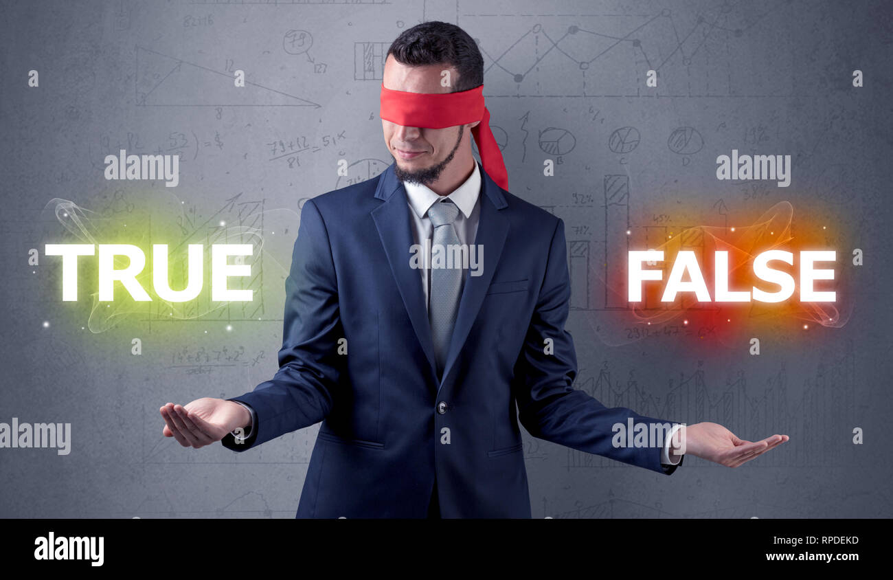 Businessman with red ribbon on his eye deciding true or false Stock ...