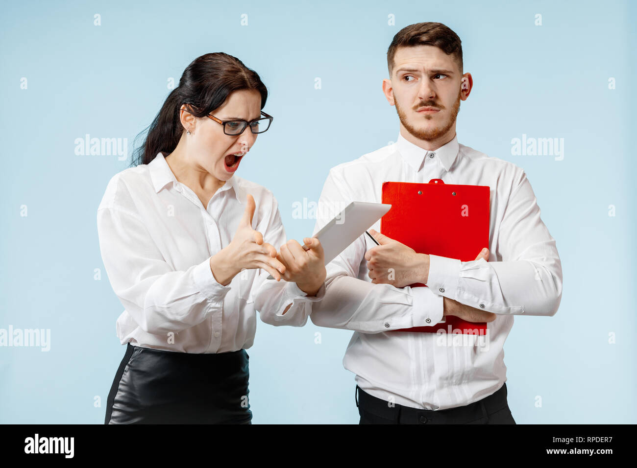 Angry boss. Woman and his secretary standing at office or studio ...