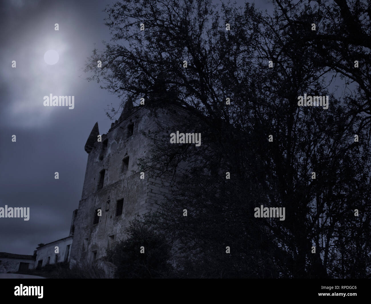 Creepy medieval tower in an overcast full moon night Stock Photo - Alamy