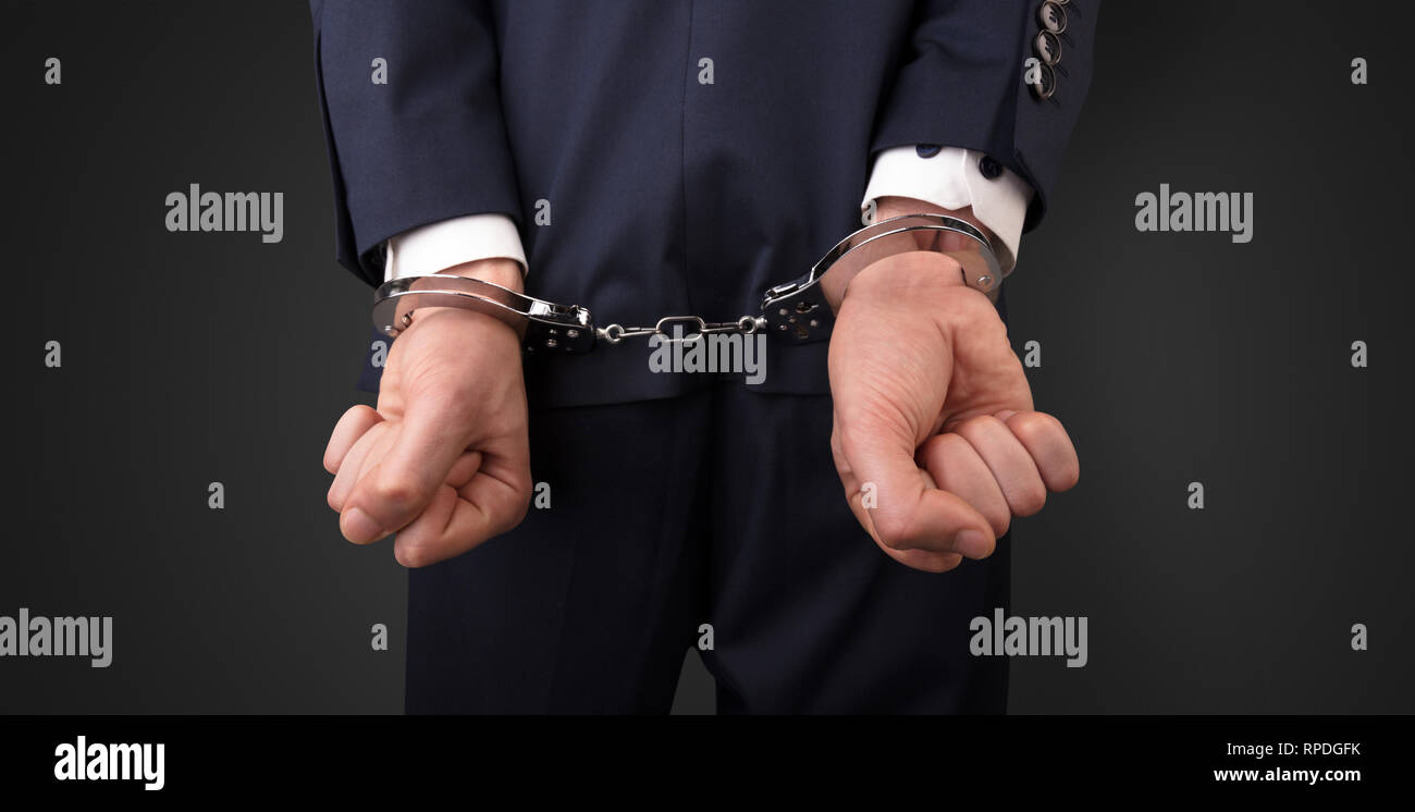 Close now arrested men hand with dark background and handcuffs Stock ...