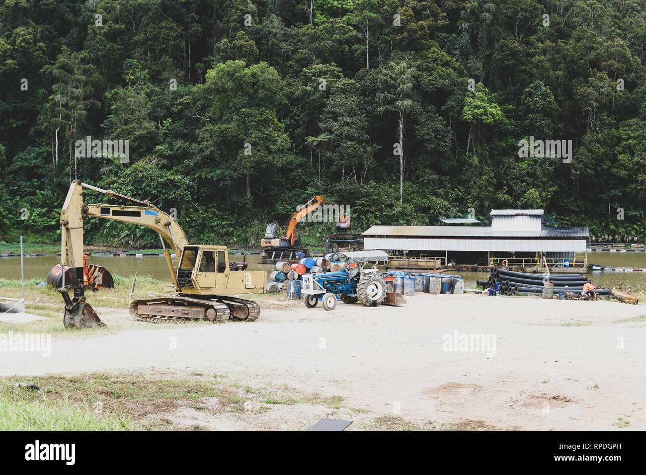 Sand dredging boat ,pump and excavator removing sand from the river bed ...
