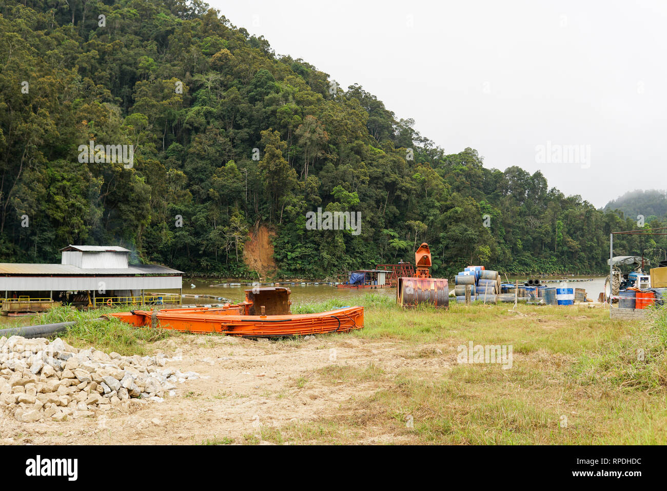 Sand dredging boat ,pump and excavator removing sand from the river bed ...
