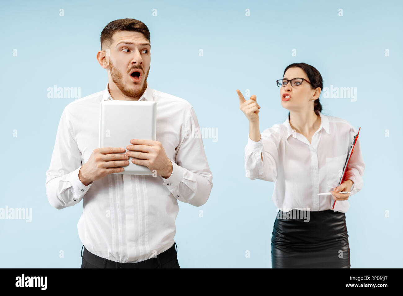 Angry boss. Woman and his secretary standing at office or studio ...