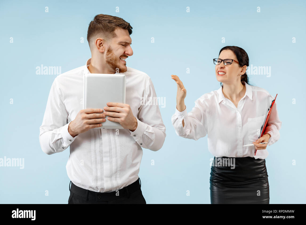 Angry boss. Woman and his secretary standing at office or studio ...