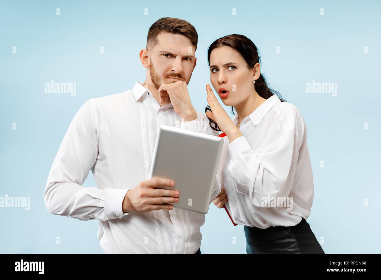 Concept of partnership in business. Young man and woman looking ...