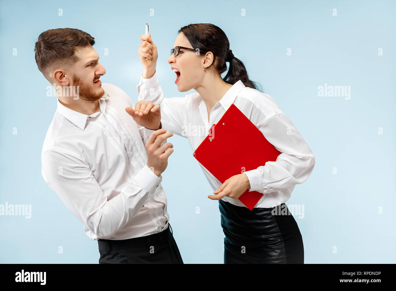 Angry boss. Woman and his secretary standing at office or studio ...