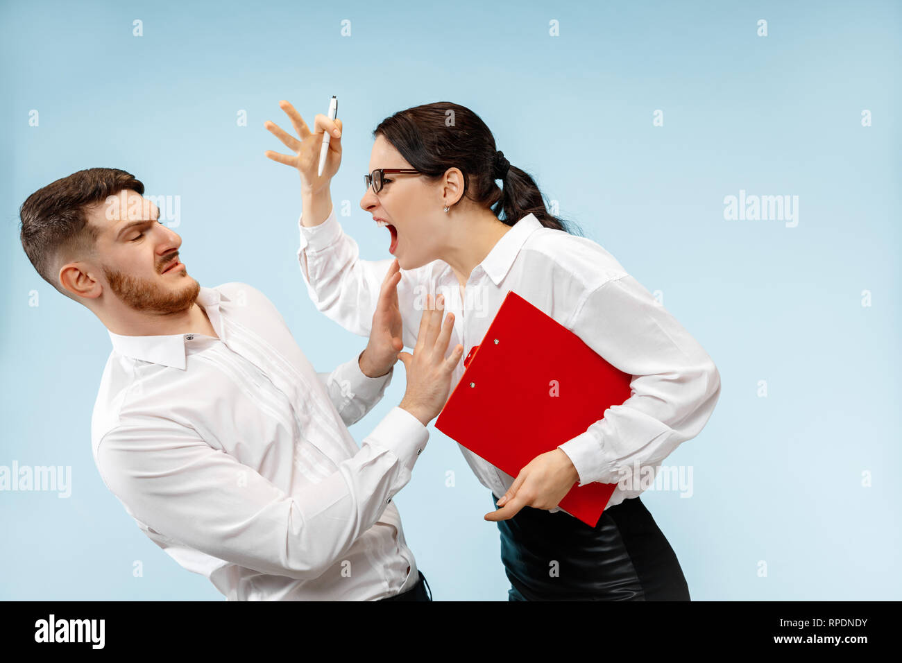 Angry boss. Woman and his secretary standing at office or studio ...