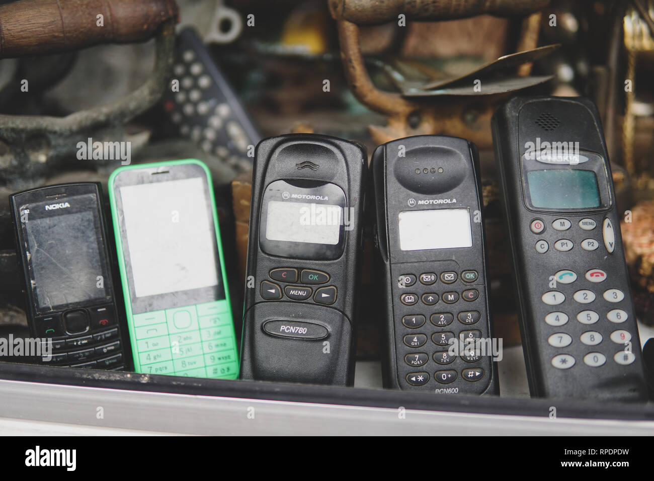 Old and obsolete mobile phone or cell phones on space of old wood ...