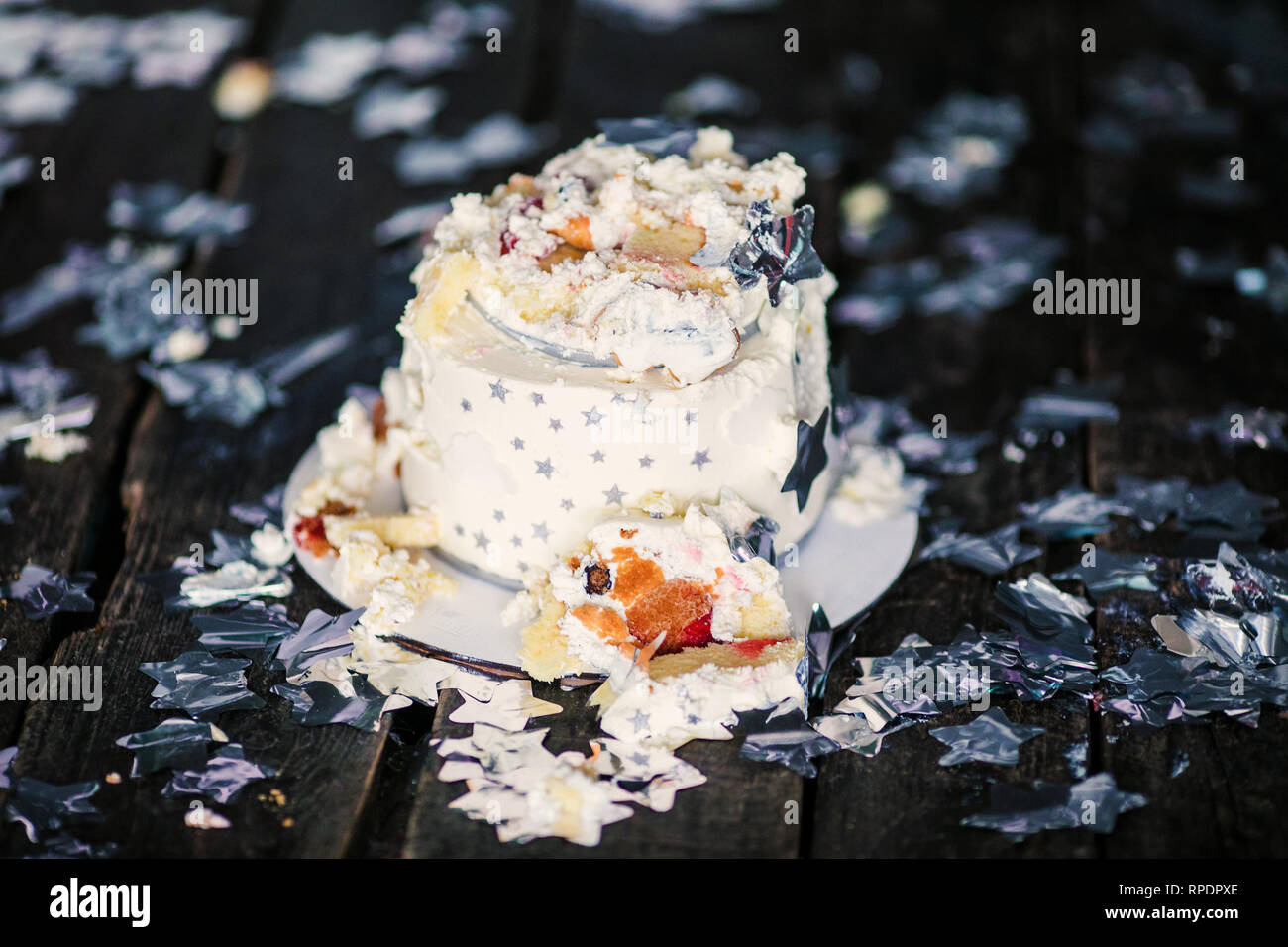 Smashed first birthday white cake with stars and one candle for little ...