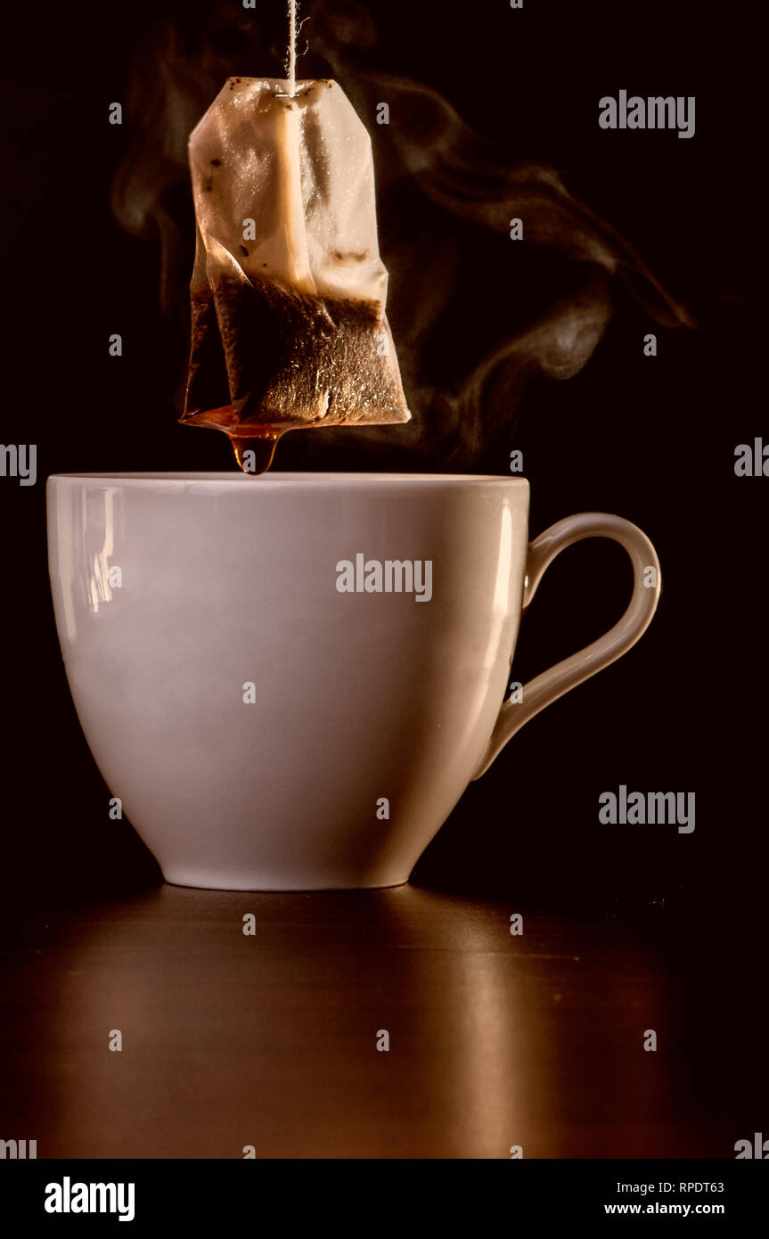 tea bag over a mug Stock Photo - Alamy