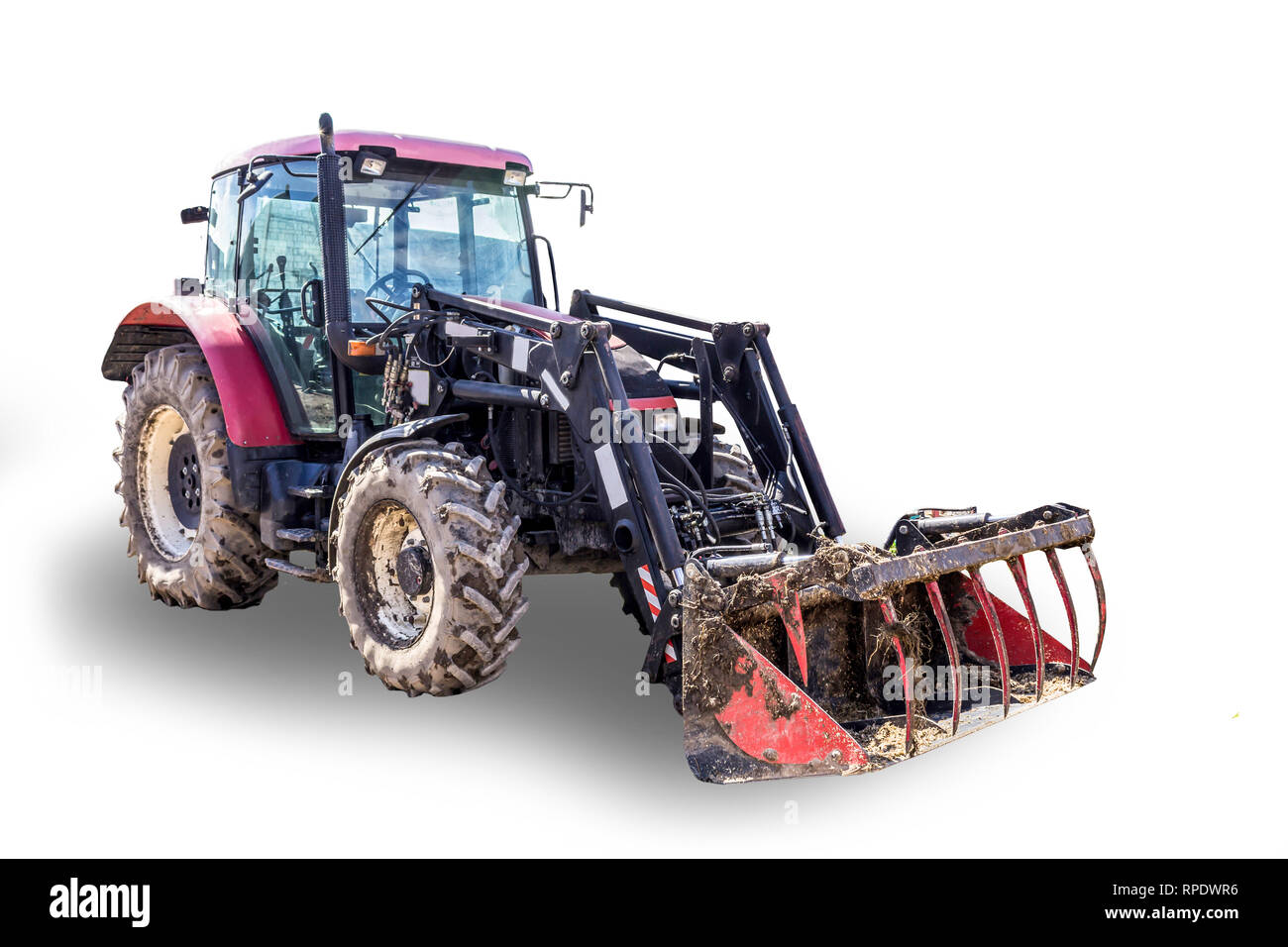 General view of a powerful tractor with a front loader for manure mixed ...