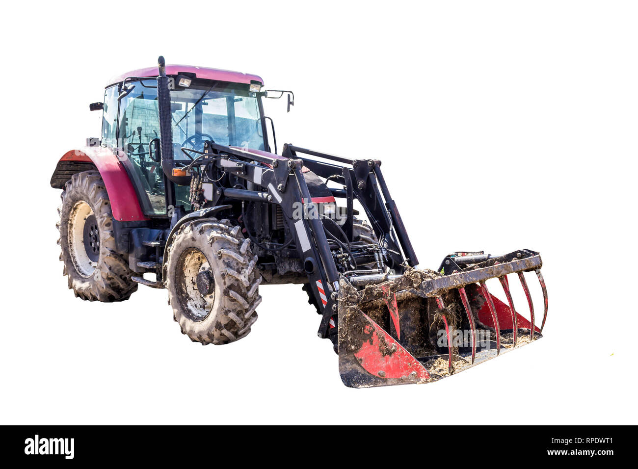 General view of a powerful tractor with a front loader for manure mixed ...